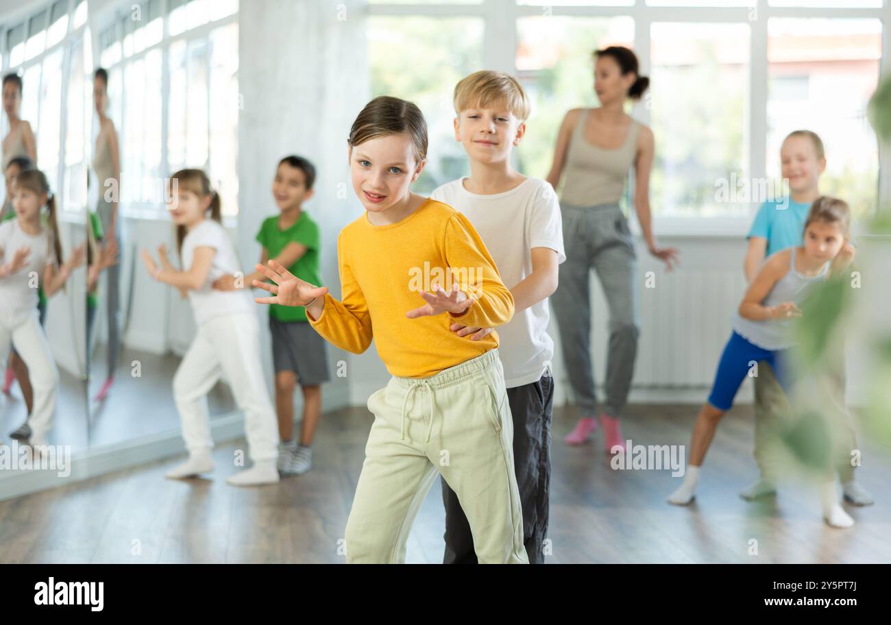 Group of children dancing couple twist dance Stock Photo - Alamy