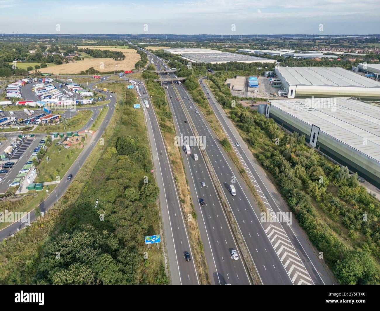 Aerial view of the M6 motorway looking east towards Junction 1 close to ...