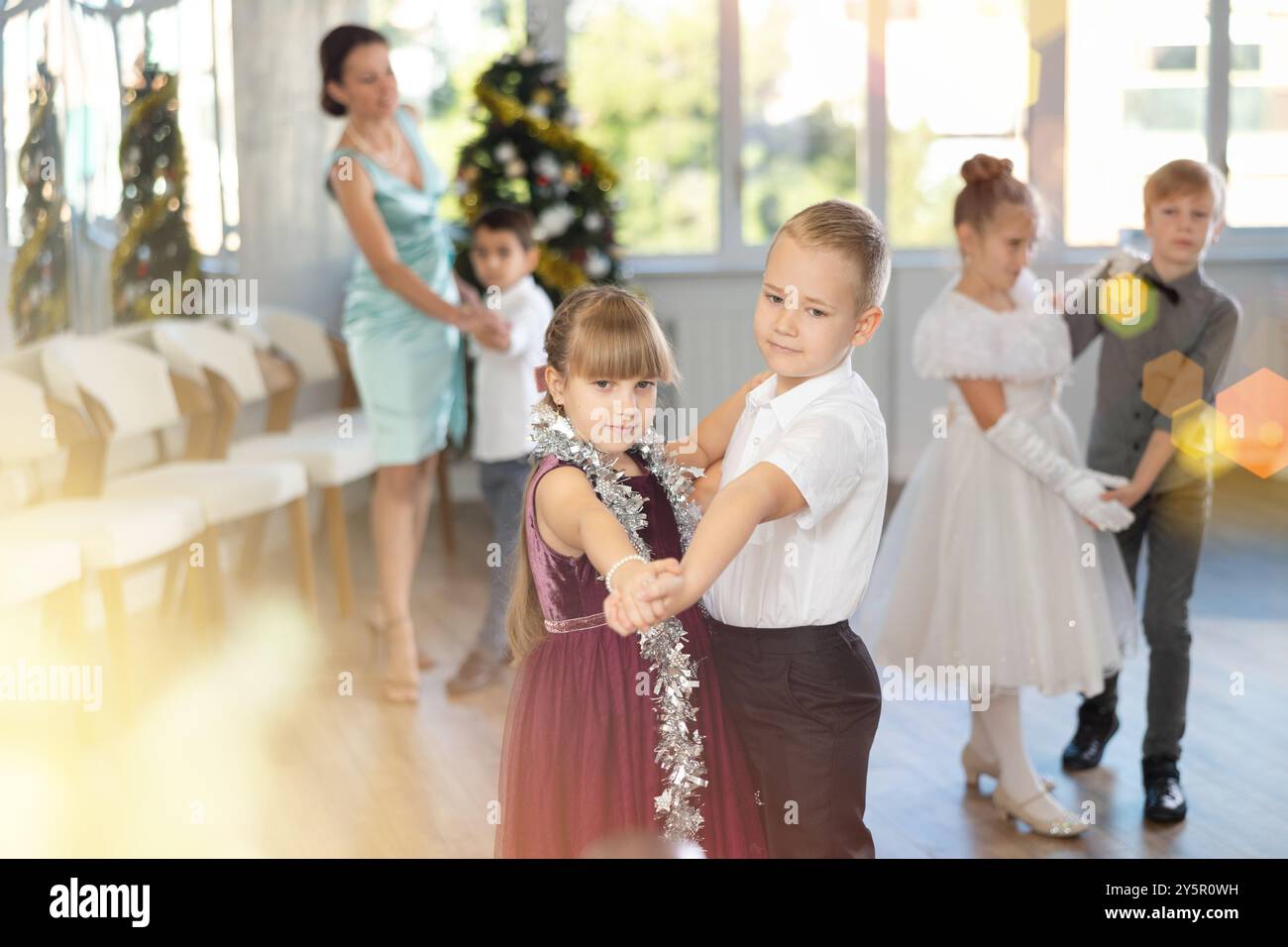 Children rehearsing ballroom dance for upcoming Christmas party at ...