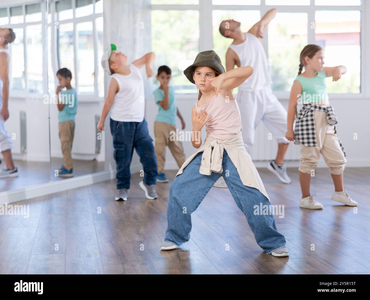 Girls and boys training hip hop in dance studio, dance classes for kids ...
