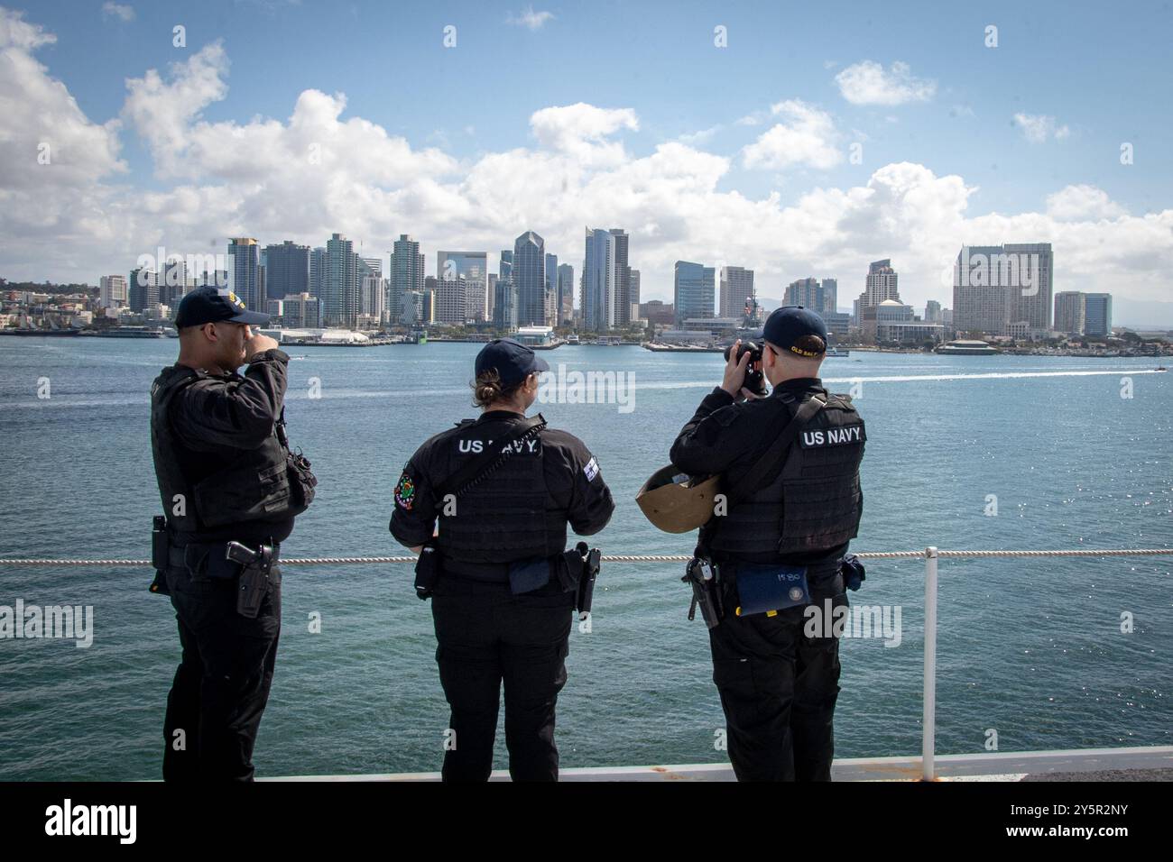 Sailors stand watch on the flight deck of the aircraft carrier USS ...