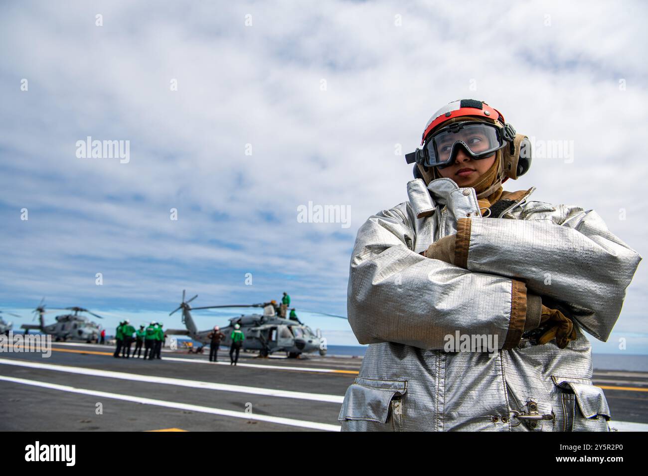 A Sailor observes flight operations on the flight deck of the aircraft ...