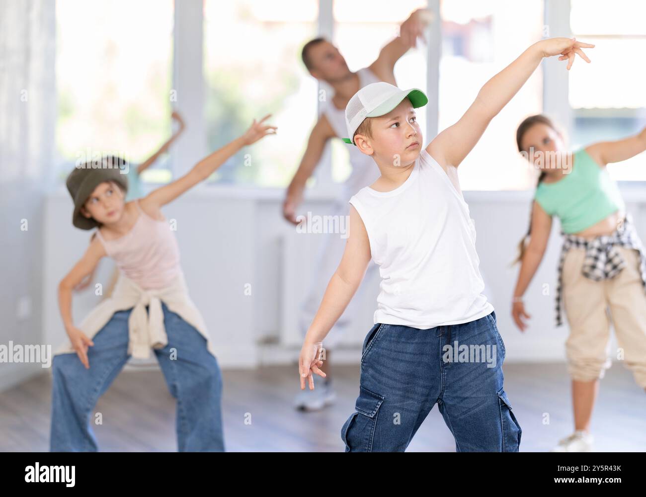 Girls and boys training hip hop in dance studio, dance classes for kids Stock Photo - Alamy
