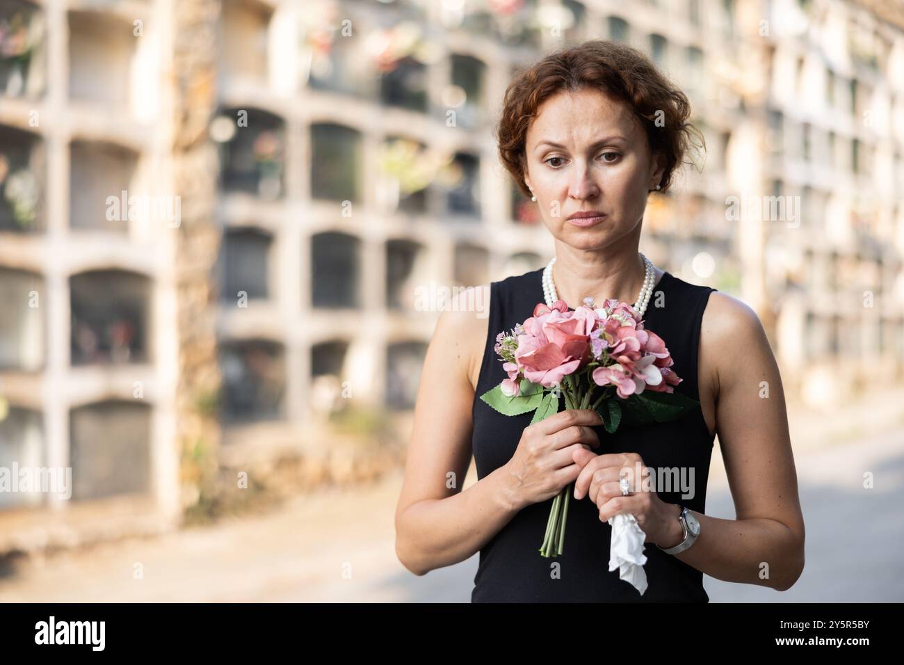 Woman brings flowers cemetery hi-res stock photography and images - Alamy