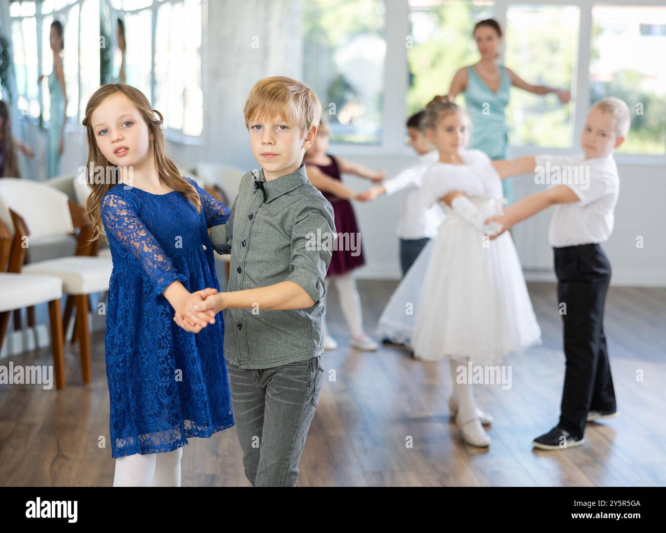 Preteen pupils rehearsing ballroom dance for festive school event Stock ...