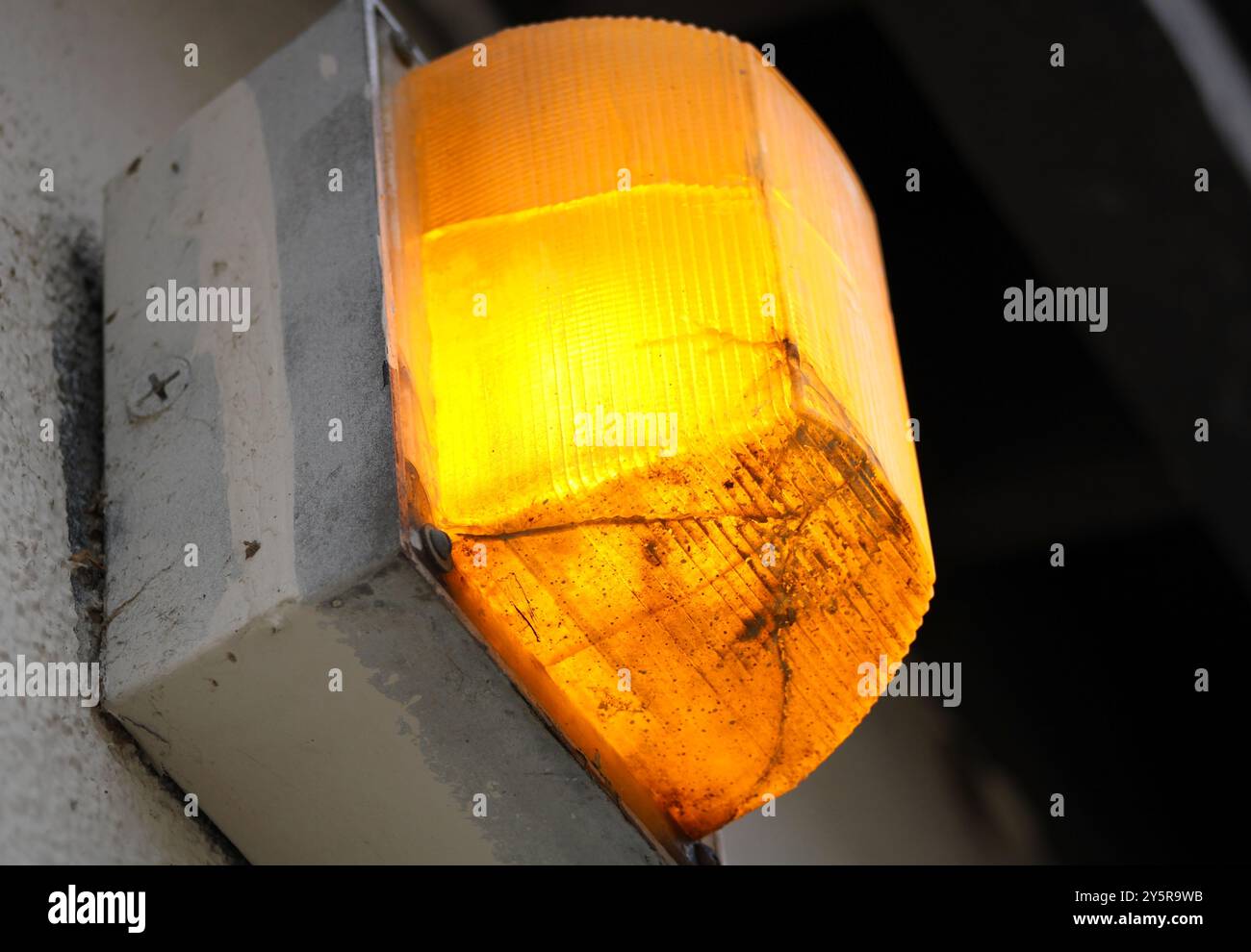 glowing yellow orange wall light Stock Photo - Alamy