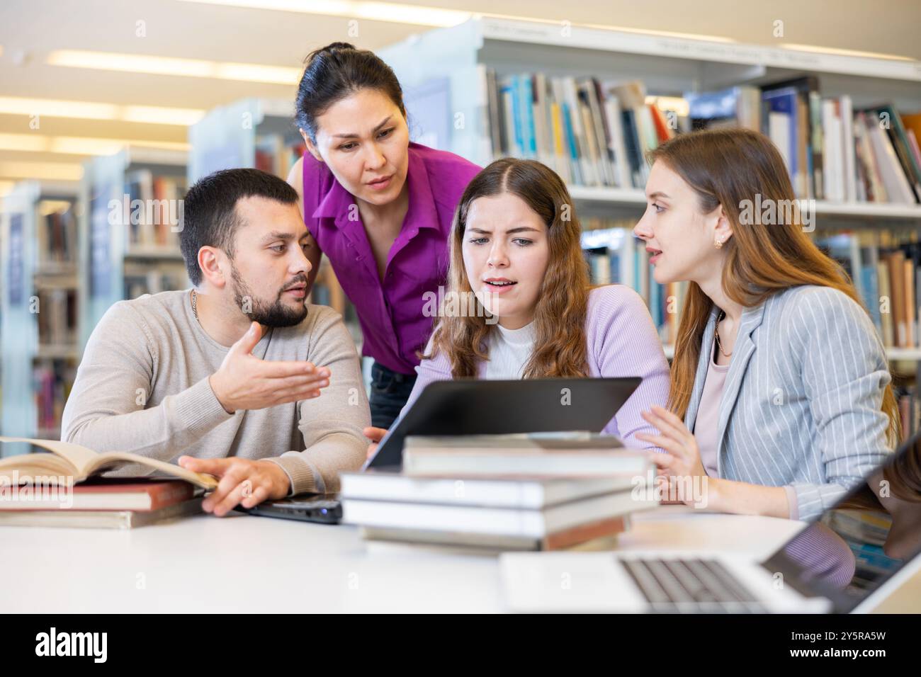 Group portrait of smiling positive engaged in research, working ...