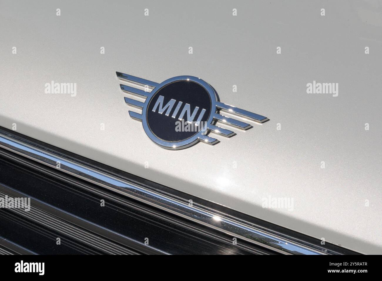 ISTANBUL, TURKEY - JULY 22, 2024: Mini Cooper car logo on a gray Mini ...
