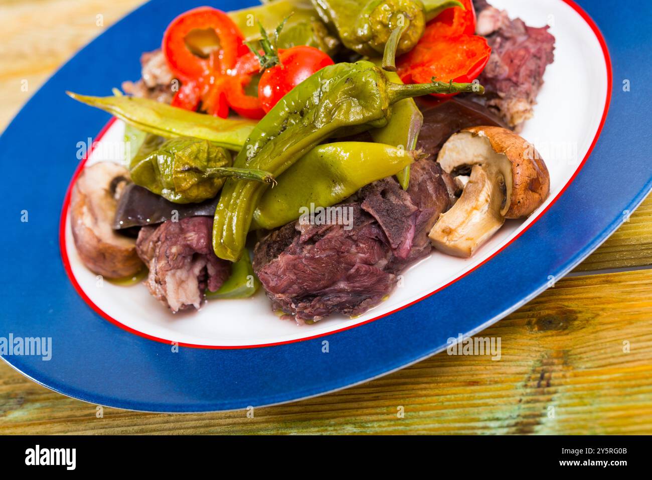 Mutton stewed in red wine with vegetables Stock Photo - Alamy