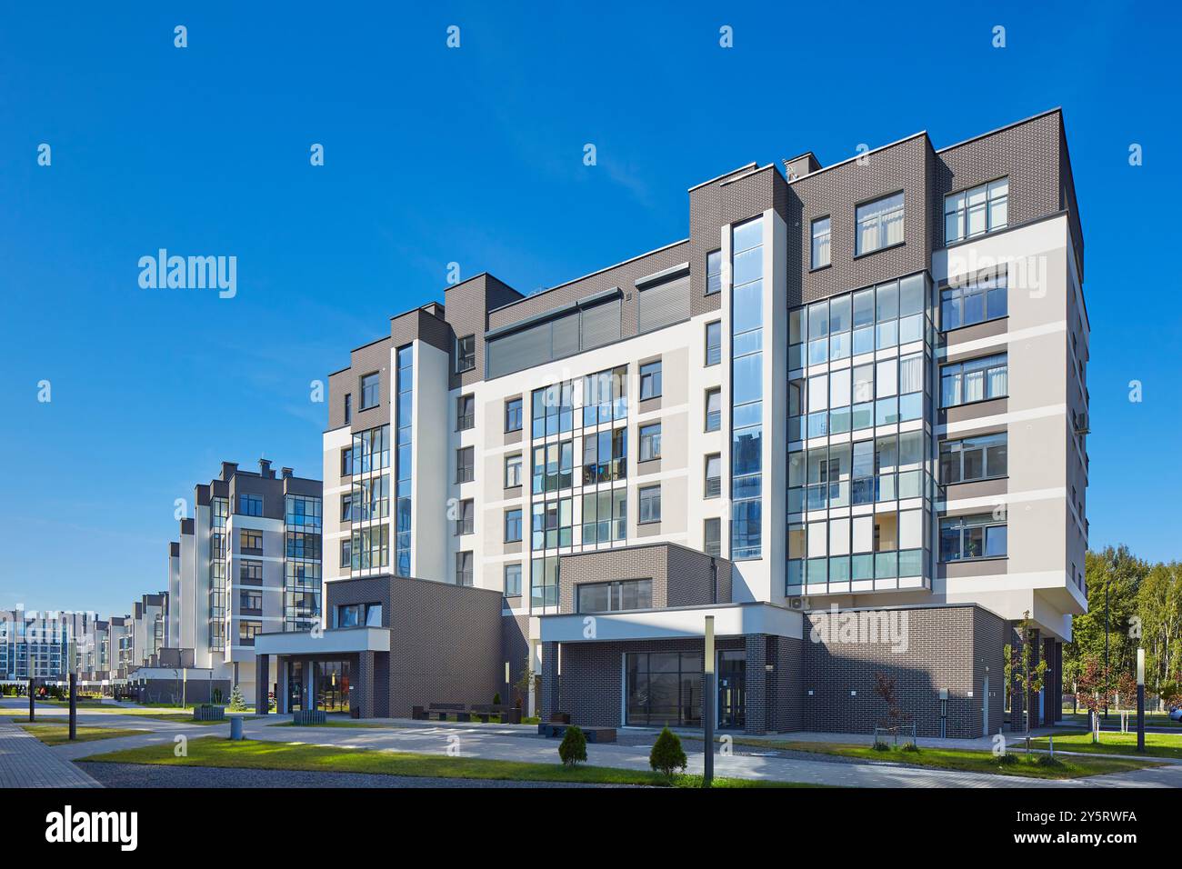 New modern block of flats in green area. residential apartment with ...