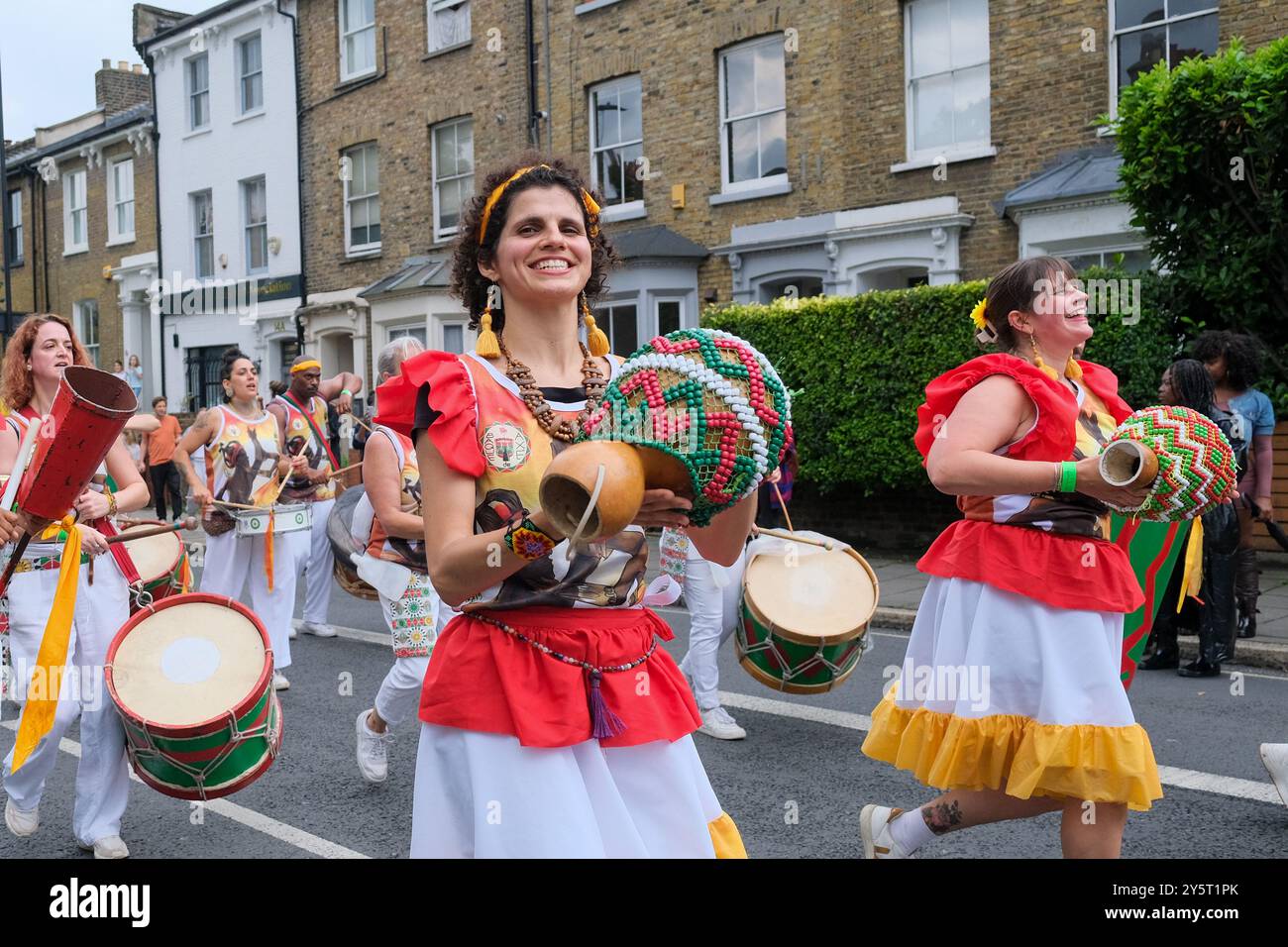 Performers, including dancers, drummers and those in costume, take part ...
