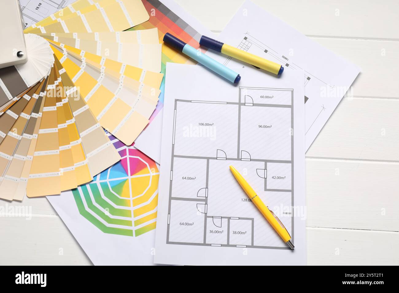 Designer's workplace with color palettes, floor plans and stationery on ...