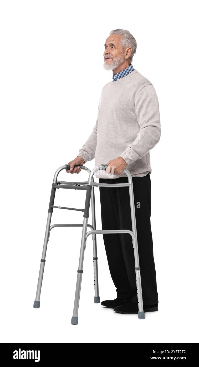 Senior man using walking frame on white background Stock Photo - Alamy