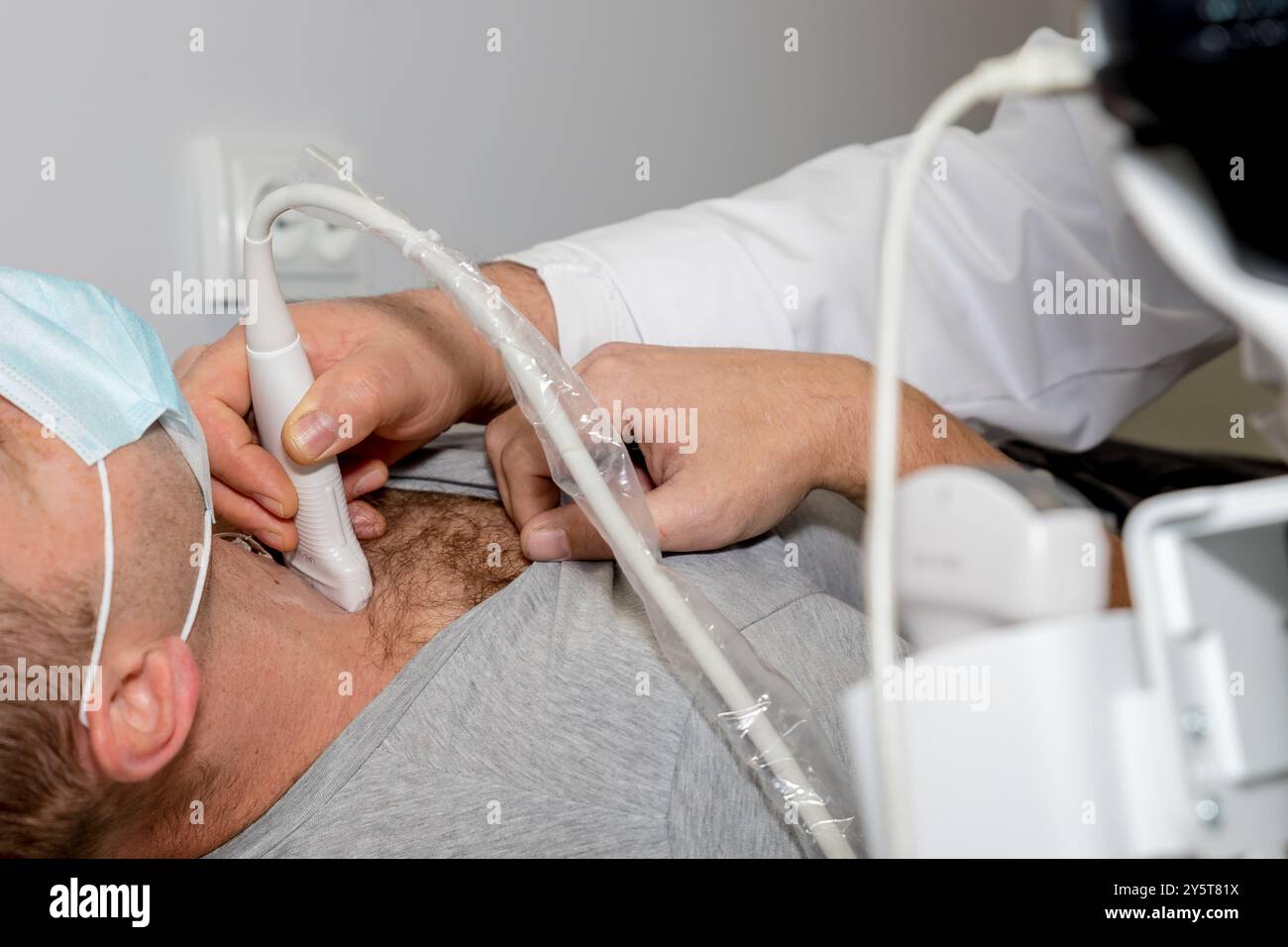 Ultrasound scanning diagnostic of woman thyroid gland in clinic, doctor ...