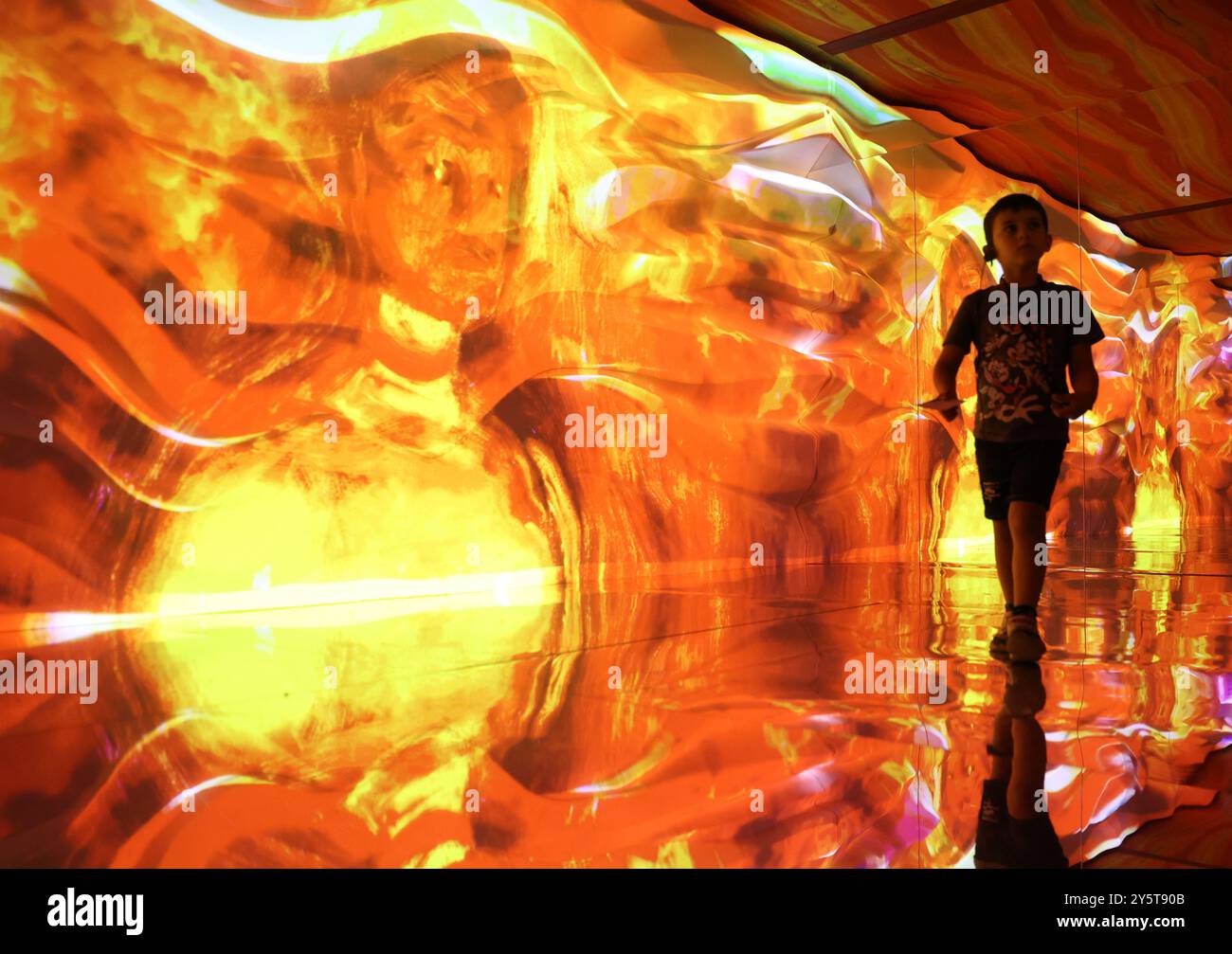 Milan, Italy. 22nd Sep, 2024. A boy walks through an interactive ...
