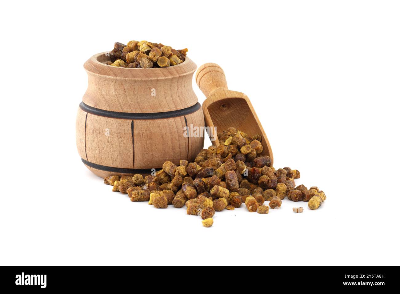 Natural bee bread in a charming wooden container with a scoop ...