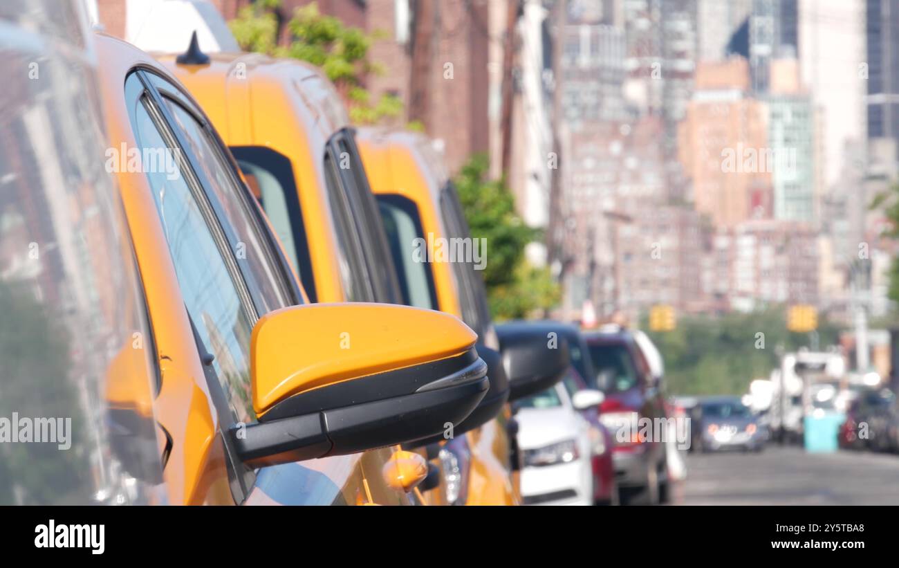 New York City. Row of yellow Taxi cars on street, Queens. Many taxi ...