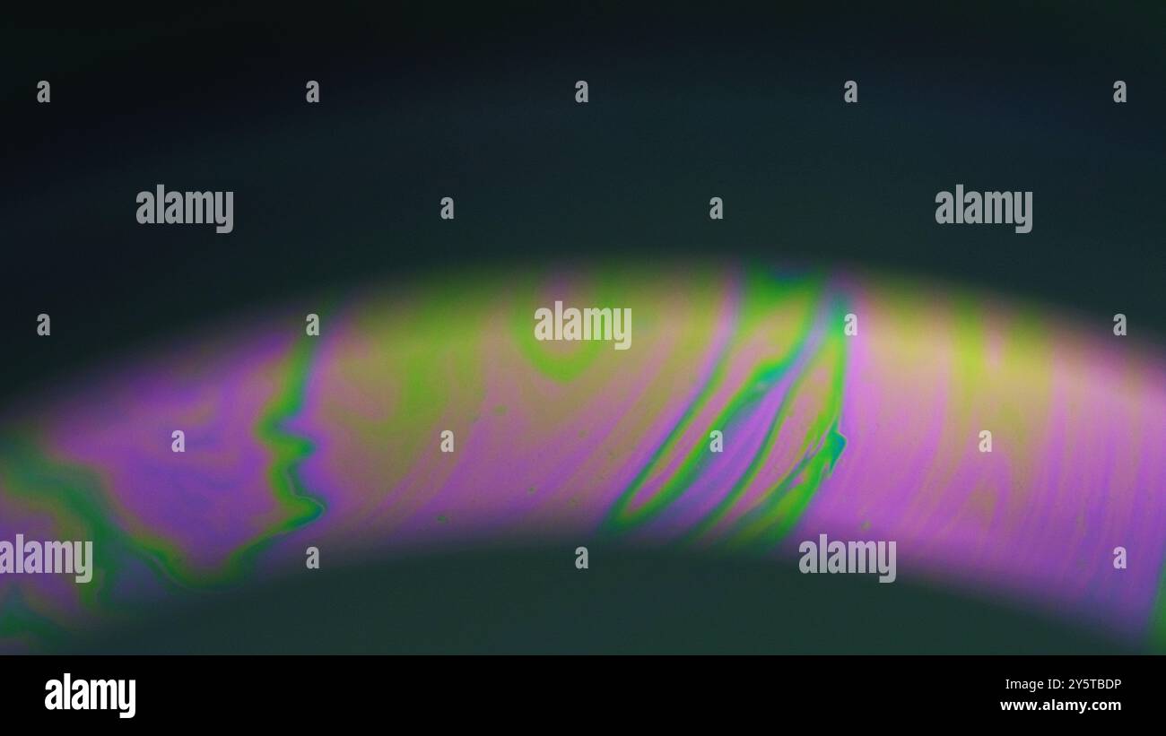 Rainbow ink. Psychedelic paint. Blur bright pink green color oil bubble ...