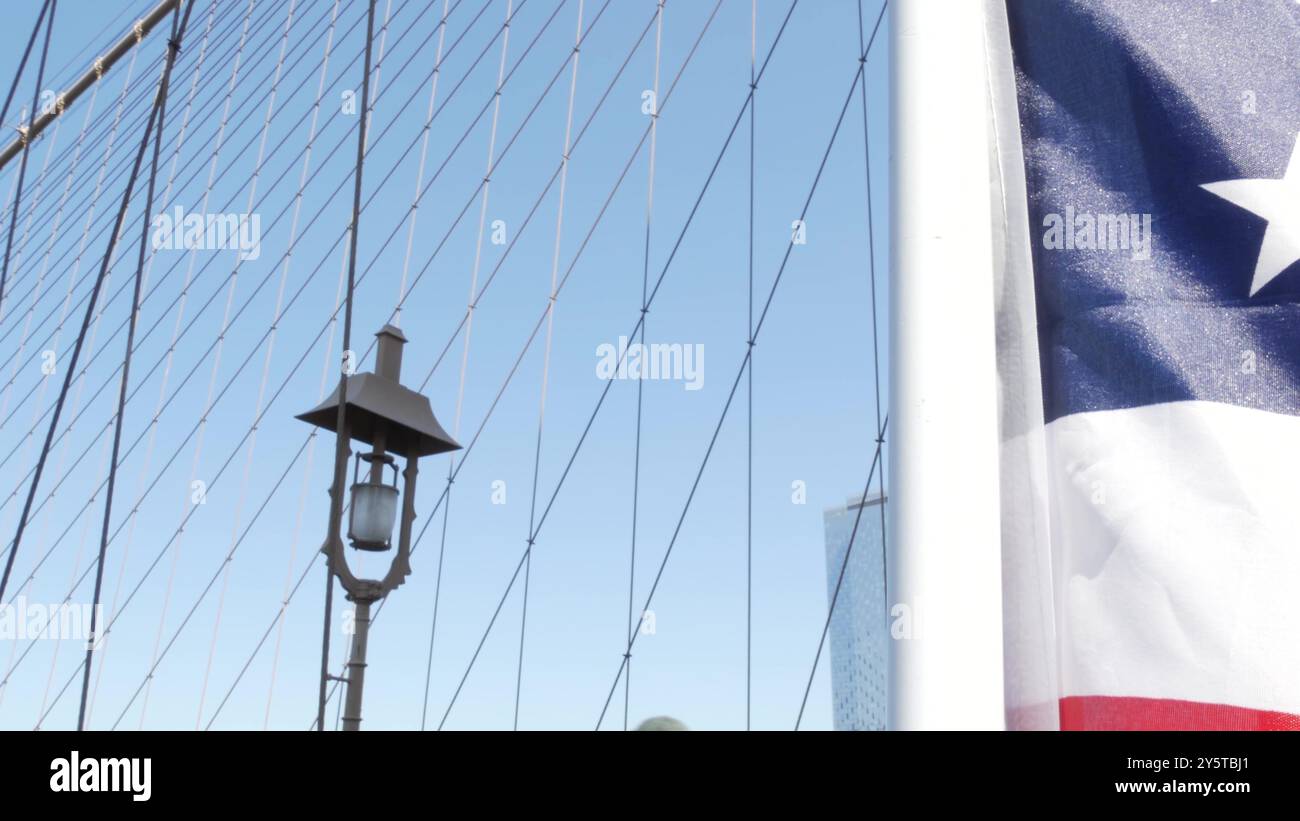 American flag on Brooklyn Bridge to Manhattan, New York City. Patriotic ...