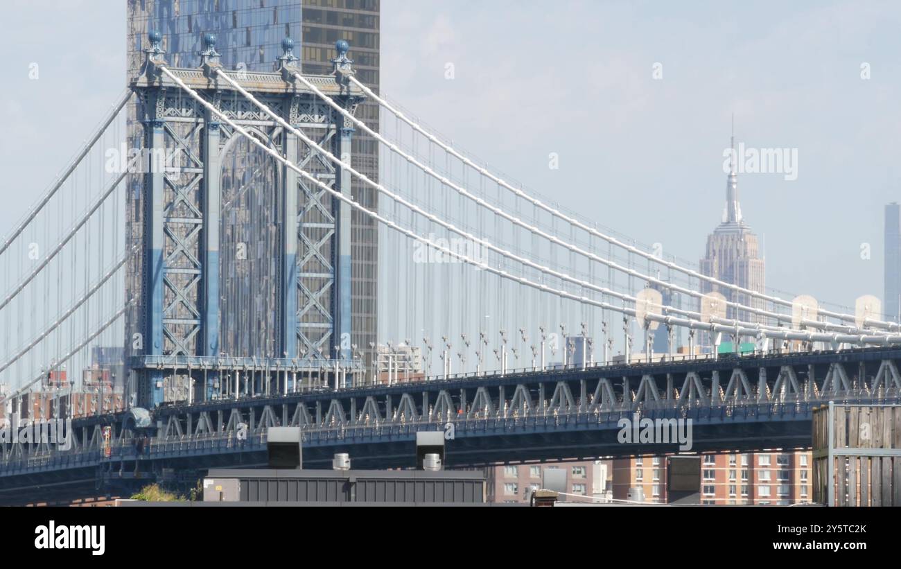 New York City Manhattan Bridge from Brooklyn Bridge view. Empire State ...