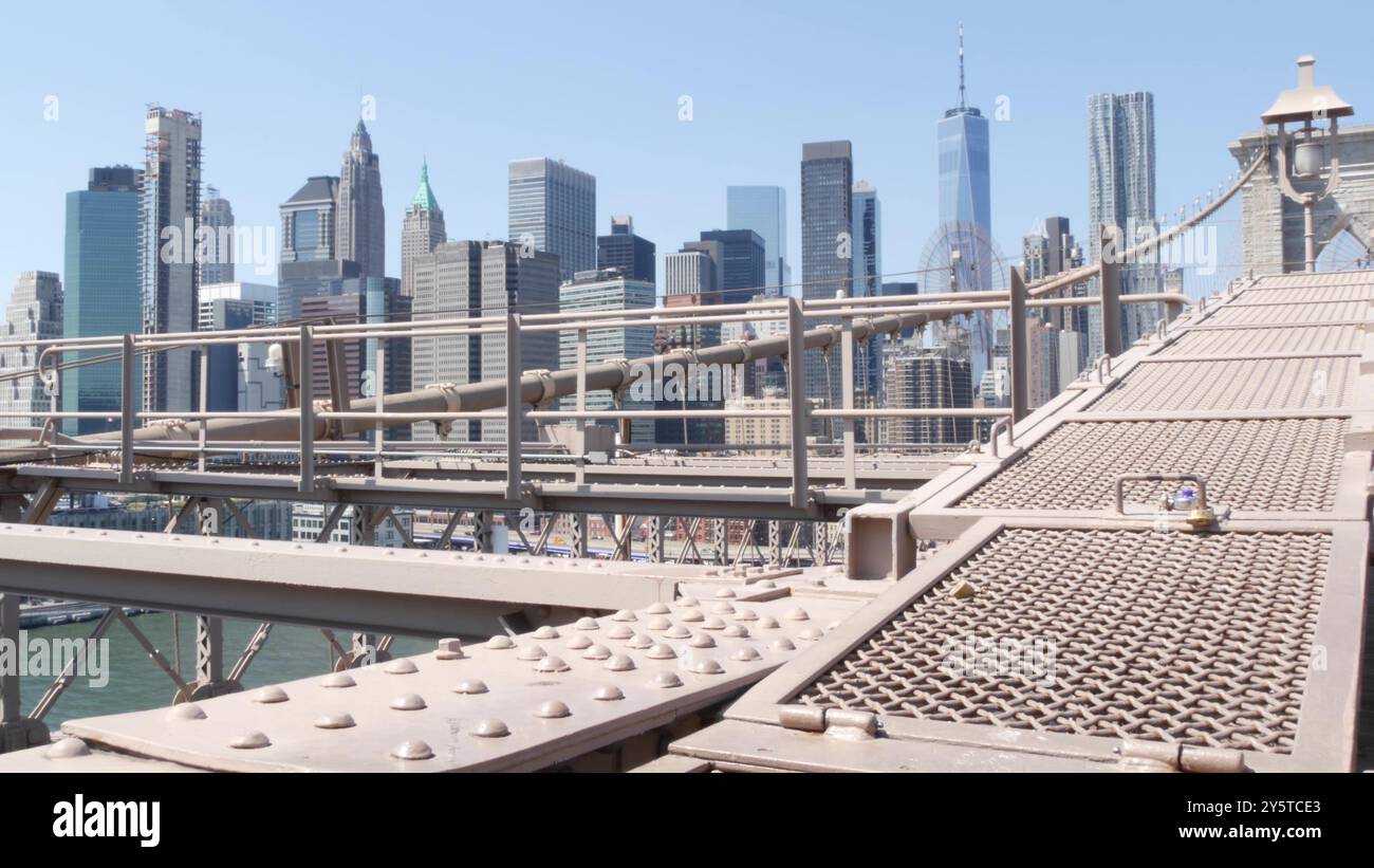 Brooklyn Bridge to Manhattan downtown. New York City skyline, financial ...