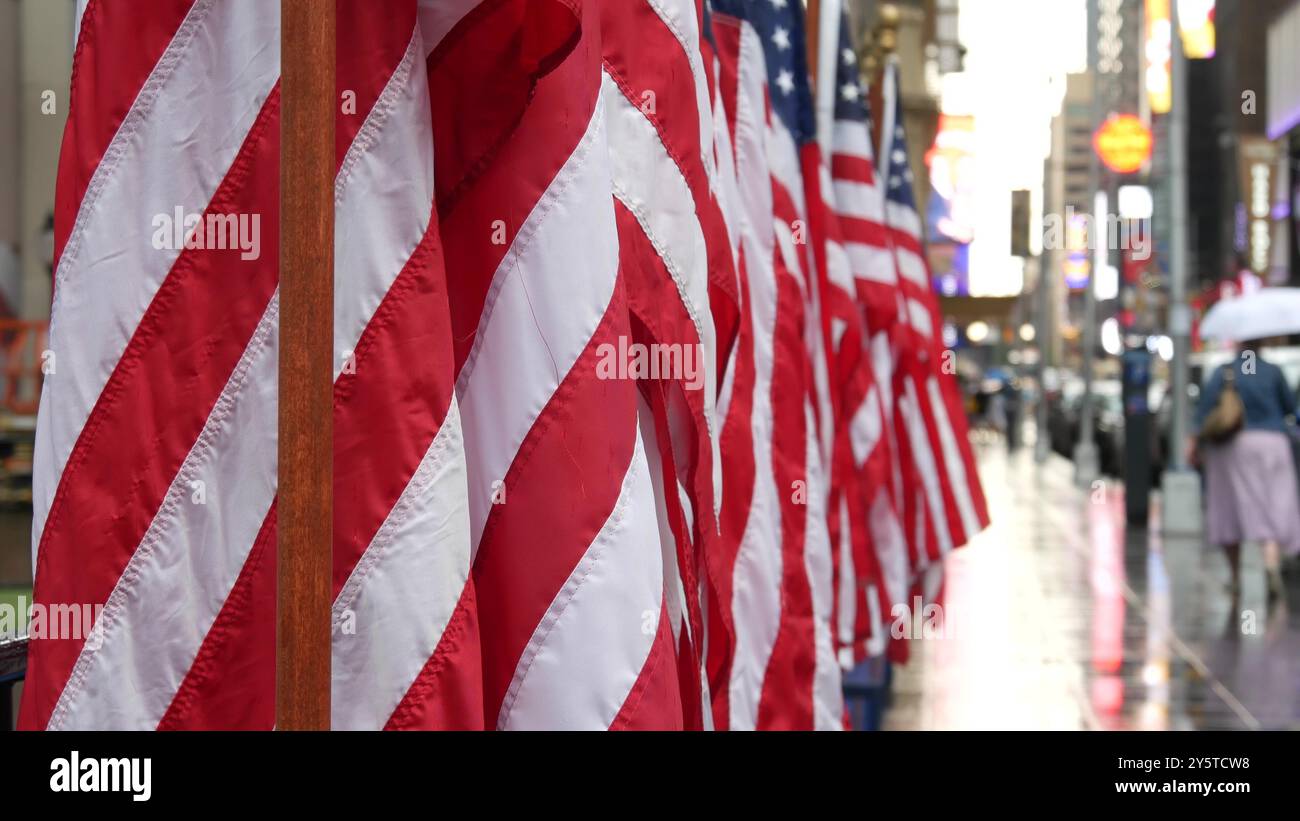 New York, row of american flags. Manhattan midtown near Broadway Times ...