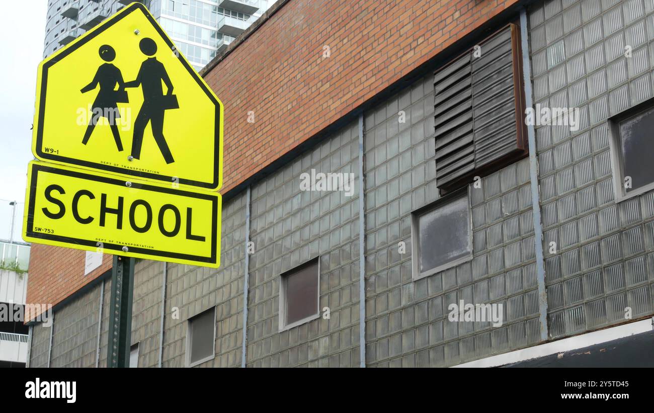 School zone yellow road sign, pedestrian crossing. Children safety on ...