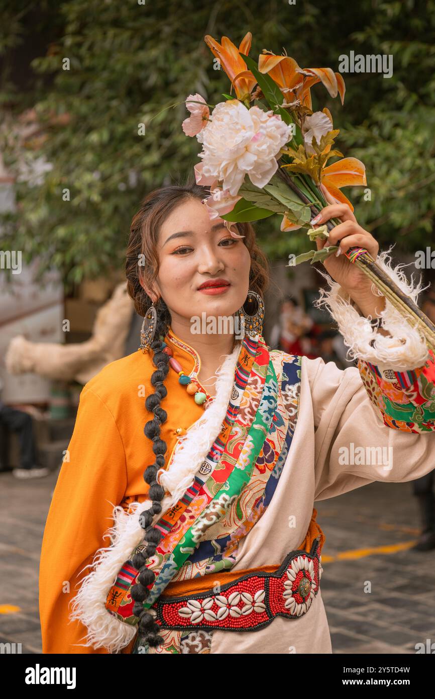 LHASA, TIBET CHINA - JULY 3, 2022: A girl wearing traditional Tibetan ...