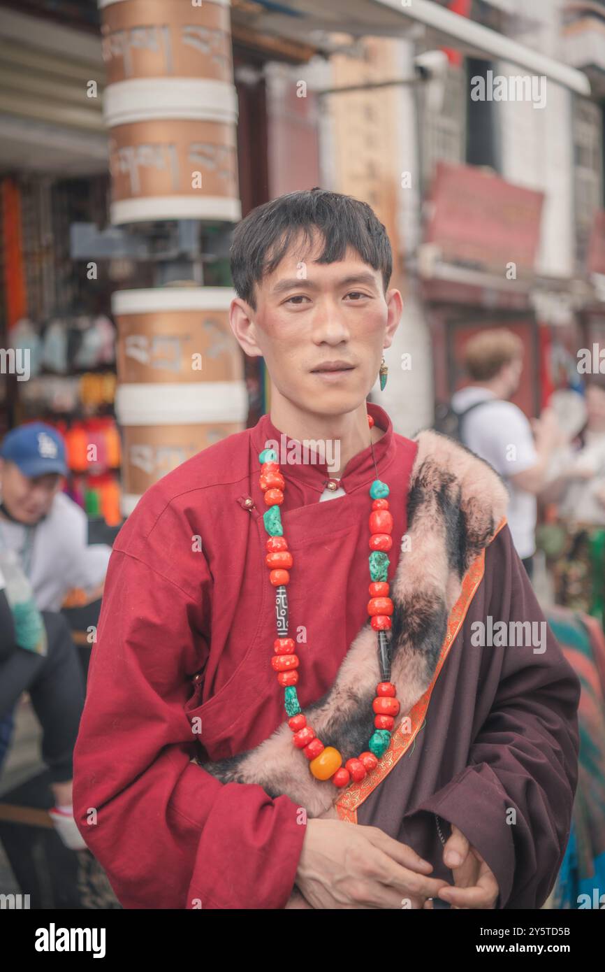 LHASA, TIBET CHINA - JULY 3, 2022: A man wearing traditional Tibetan ...