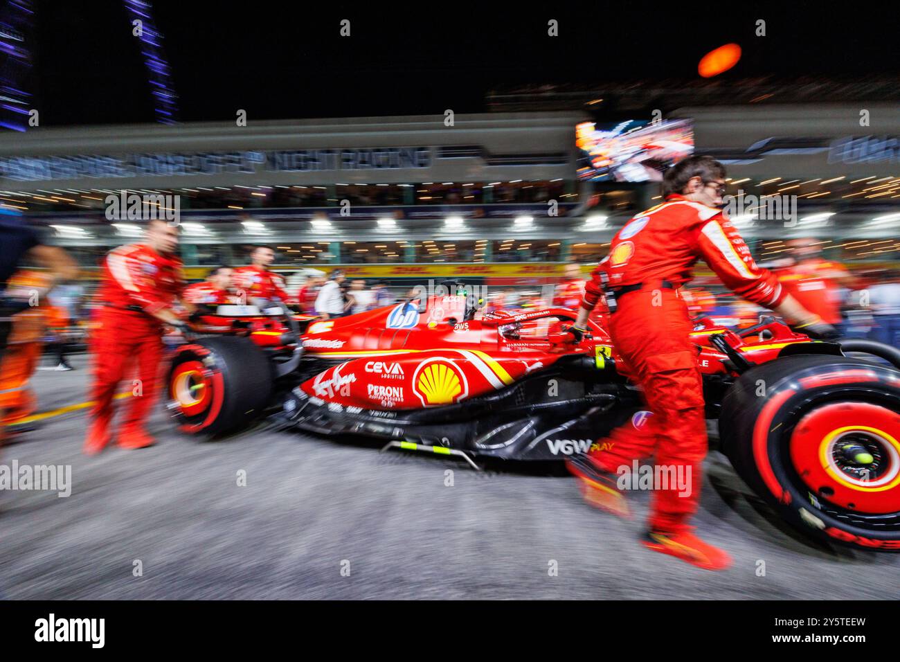 Singapore, Singapore. 22nd Sep, 2024. Scuderia Ferrari mechanics push ...