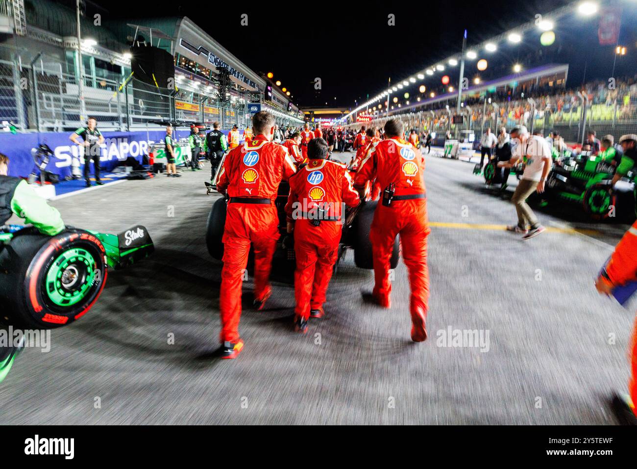 Singapore, Singapore. 22nd Sep, 2024. Scuderia Ferrari mechanics push ...