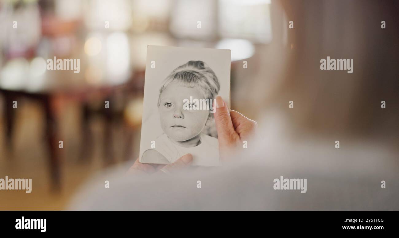 Hand, history and senior woman with picture frame for mourning, loss or ...