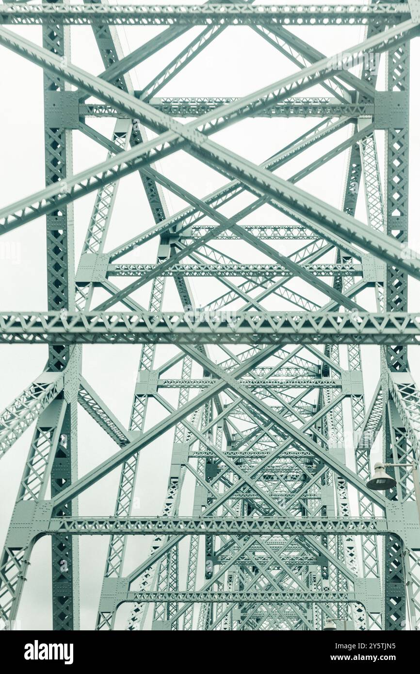 looking up at pale blue green beams of cantilever bridge Stock Photo ...