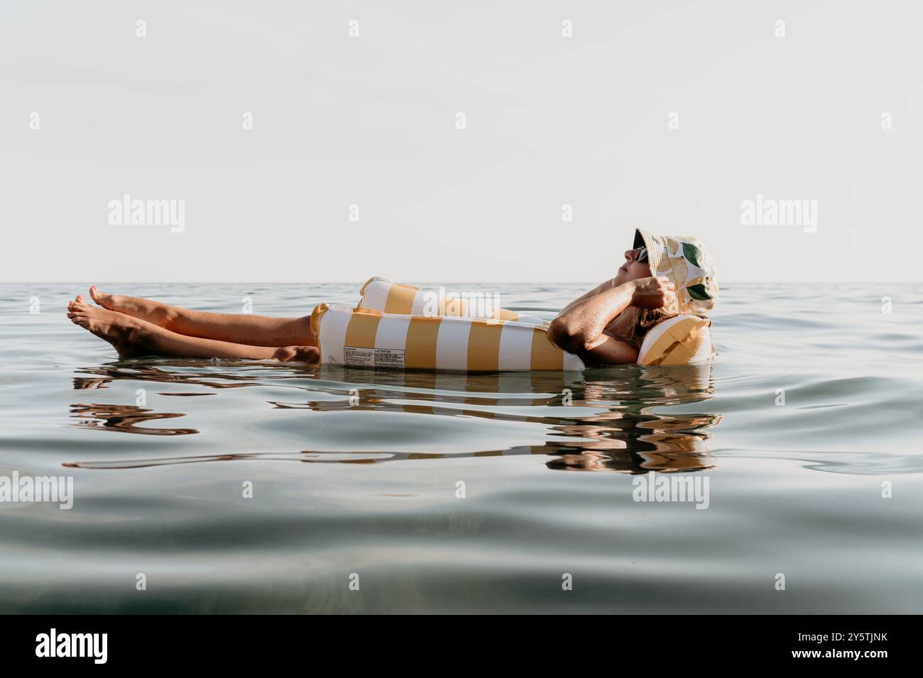 Woman, Float, Water - Woman lying on an inflatable float in the water ...
