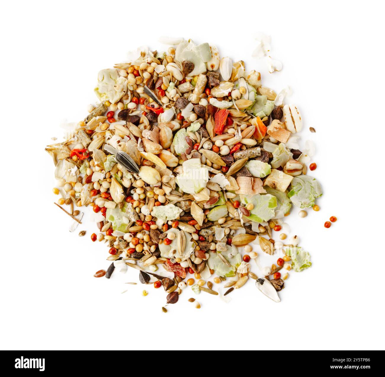 A colorful blend of bird seeds and grains displayed on a white ...