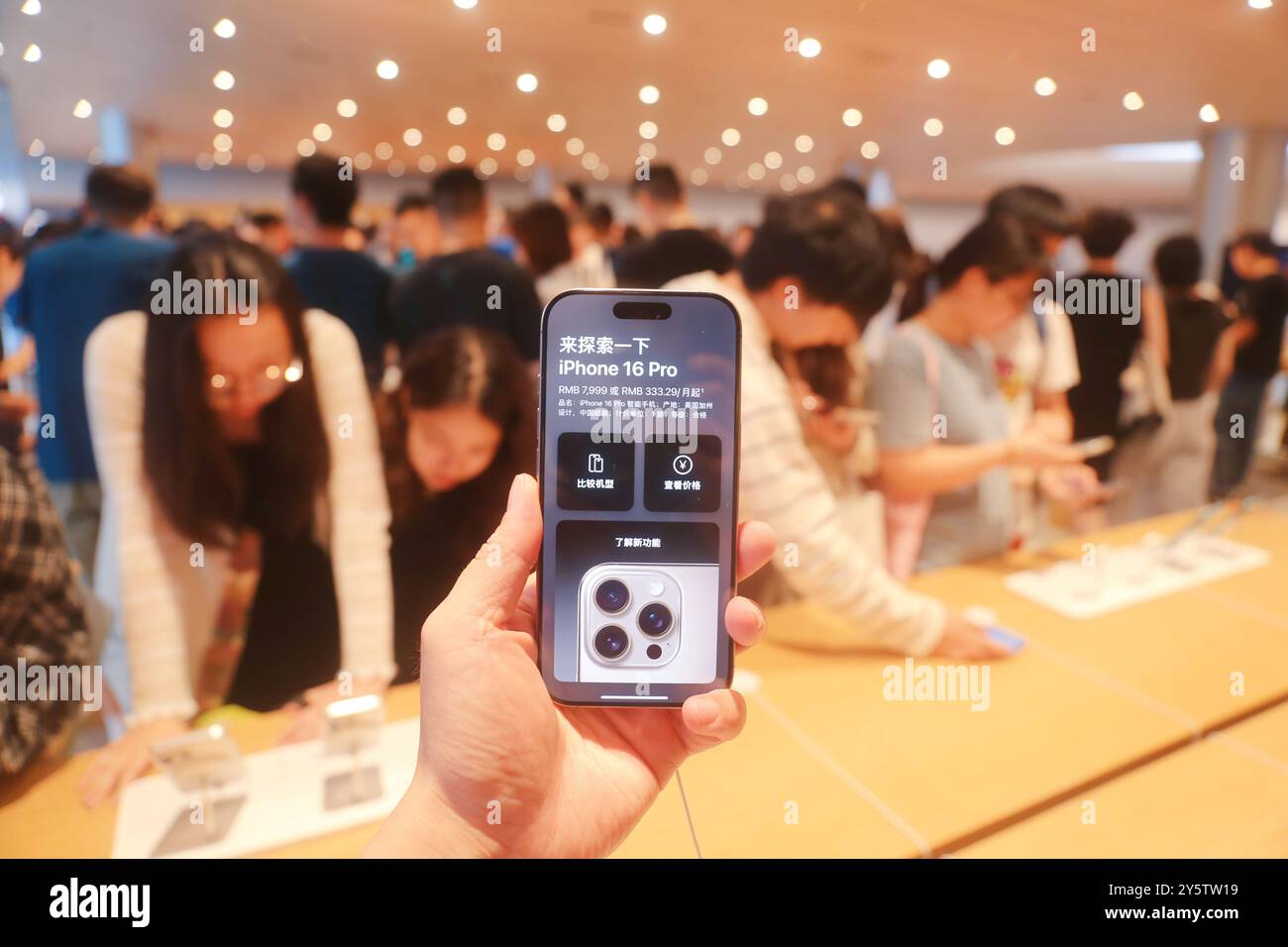 SHANGHAI, CHINA - SEPTEMBER 22, 2024 - Customers experience Apple's new ...
