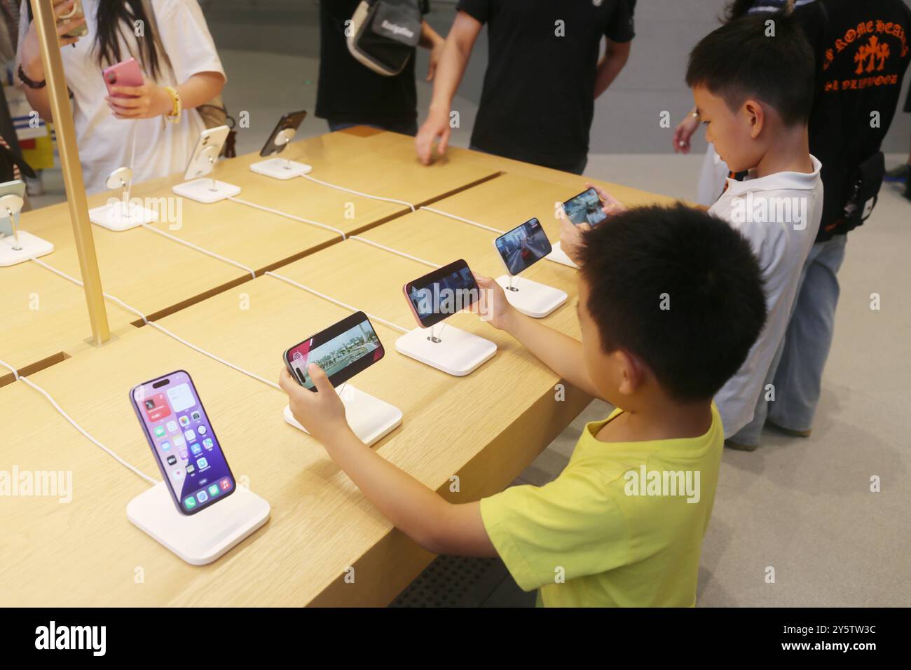 SHANGHAI, CHINA - SEPTEMBER 22, 2024 - Customers experience Apple's new ...