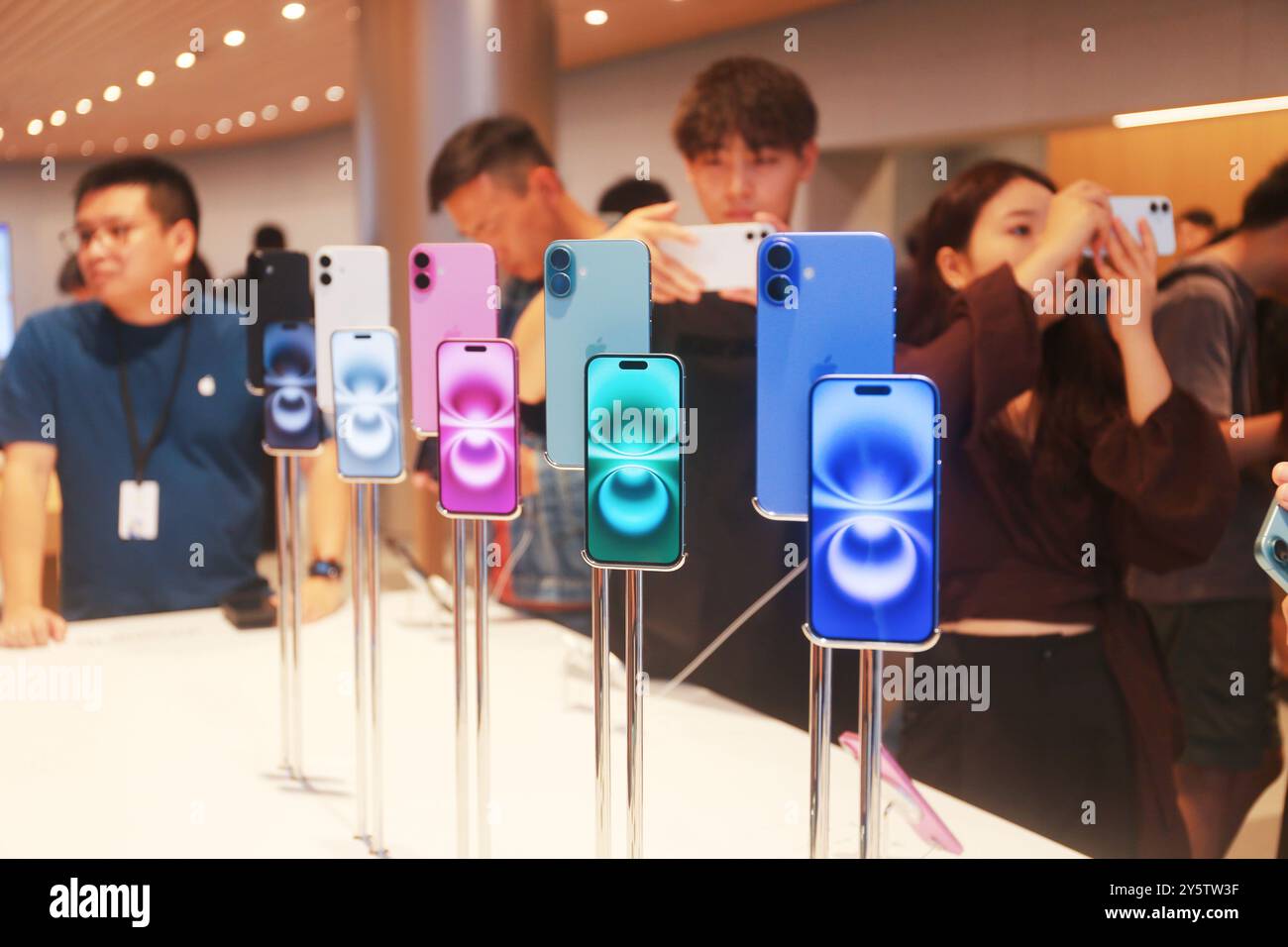 SHANGHAI, CHINA - SEPTEMBER 22, 2024 - Customers experience Apple's new ...