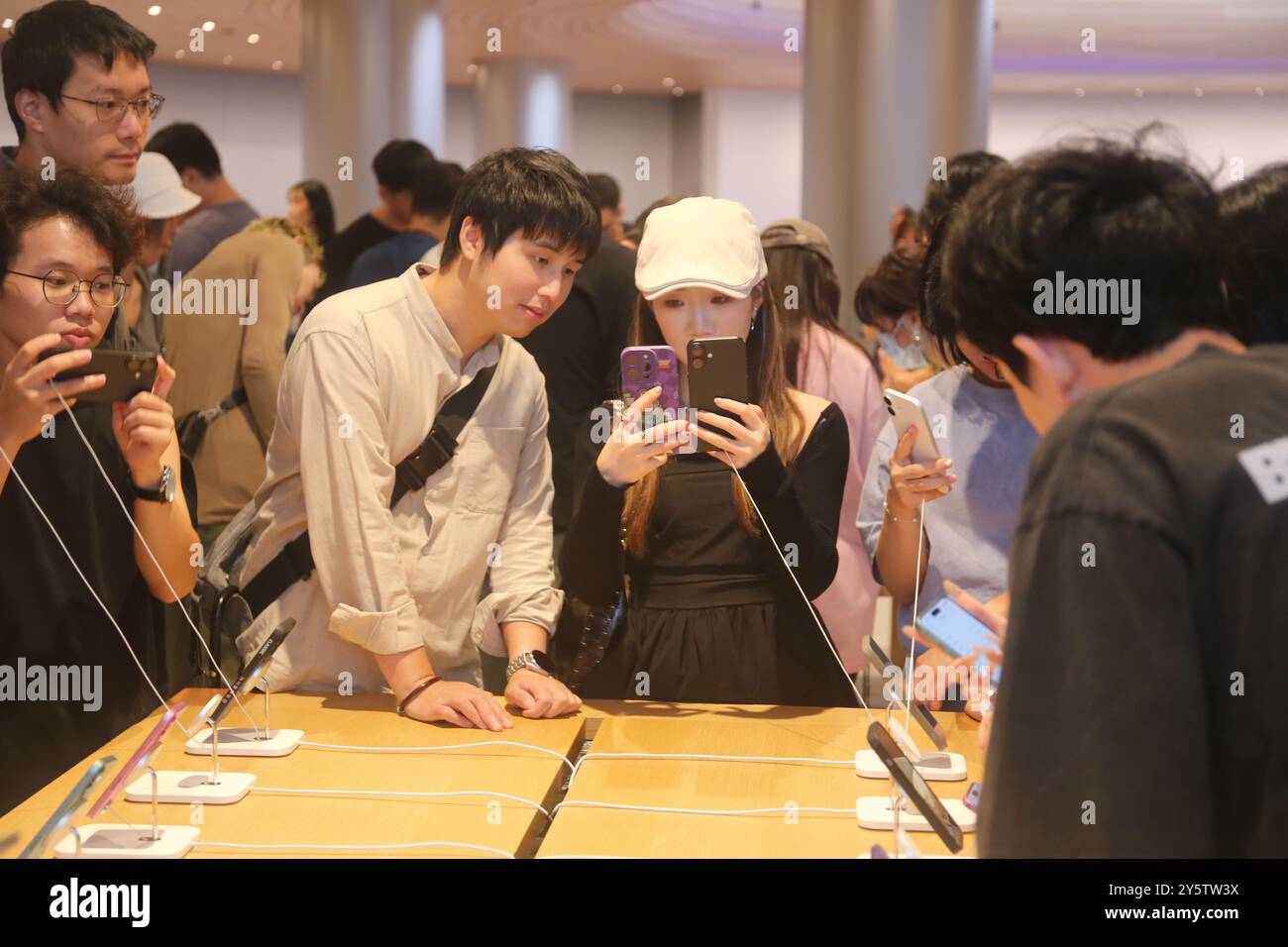 SHANGHAI, CHINA - SEPTEMBER 22, 2024 - Customers experience Apple's new ...