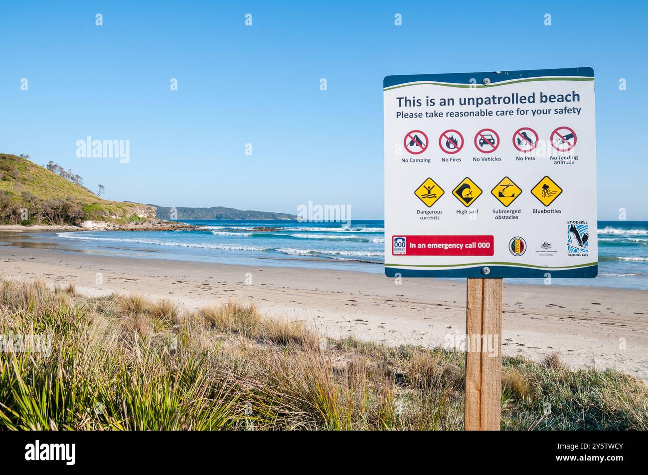 signboard for unpatrolled beach, Cave Beach, NSW, Australia Stock Photo ...
