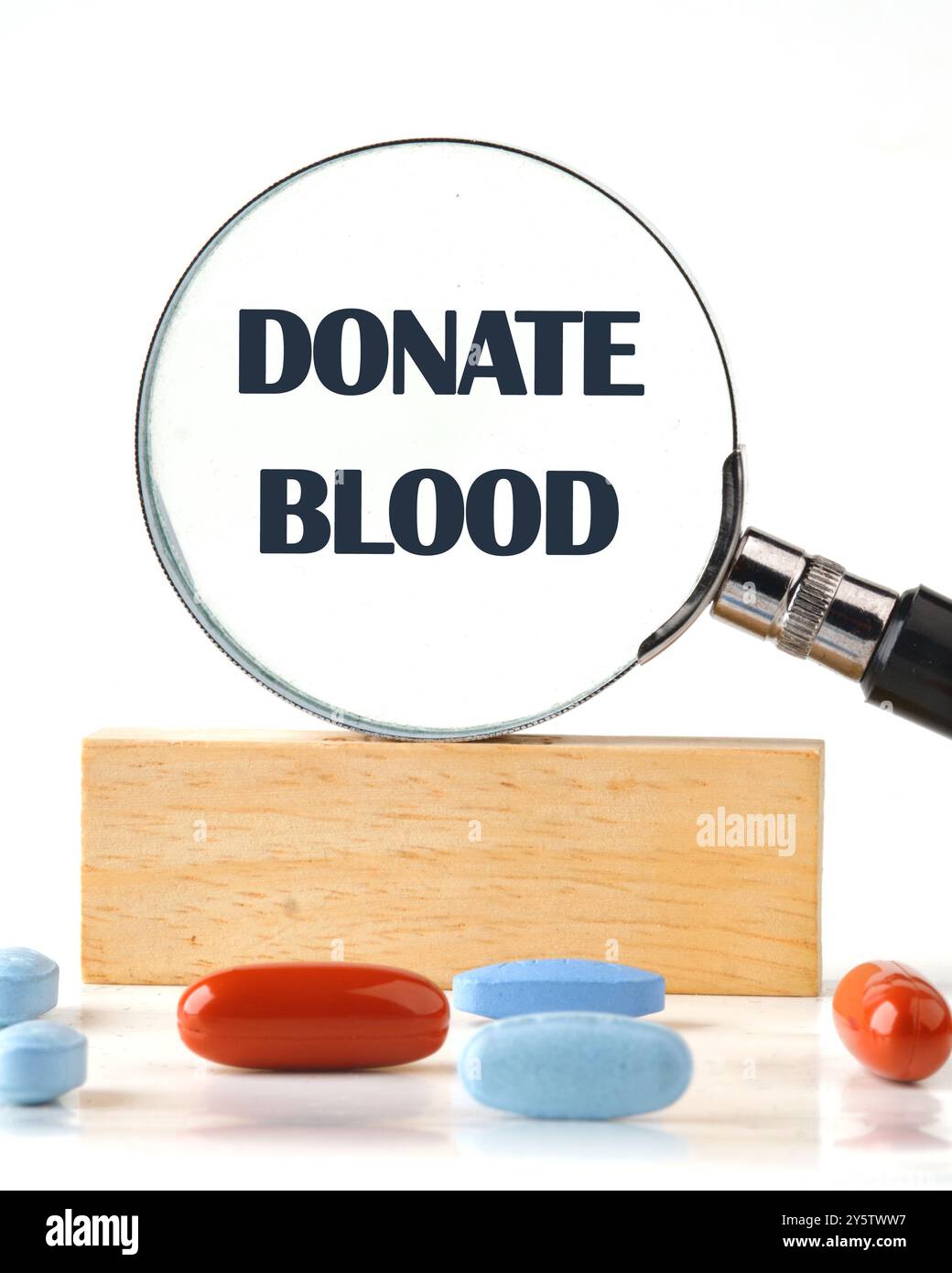 HEALTH CONSCIOUS text written close-up through a magnifying glass ...