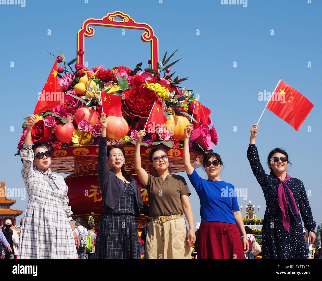 BEIJING, CHINA - SEPTEMBER 23, 2024 - Tourists pose for a group photo ...