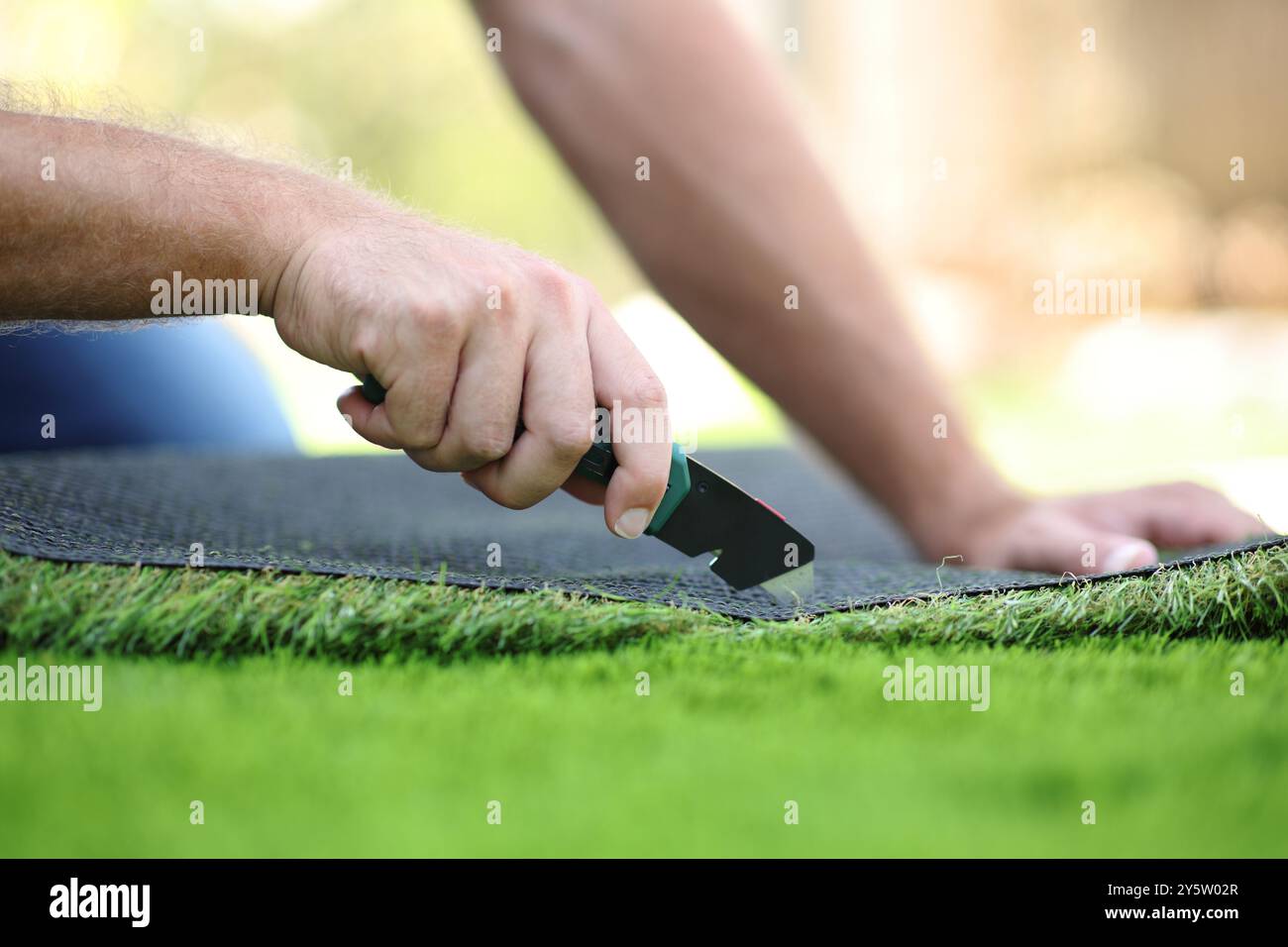 Close up man installing grass hi-res stock photography and images - Alamy