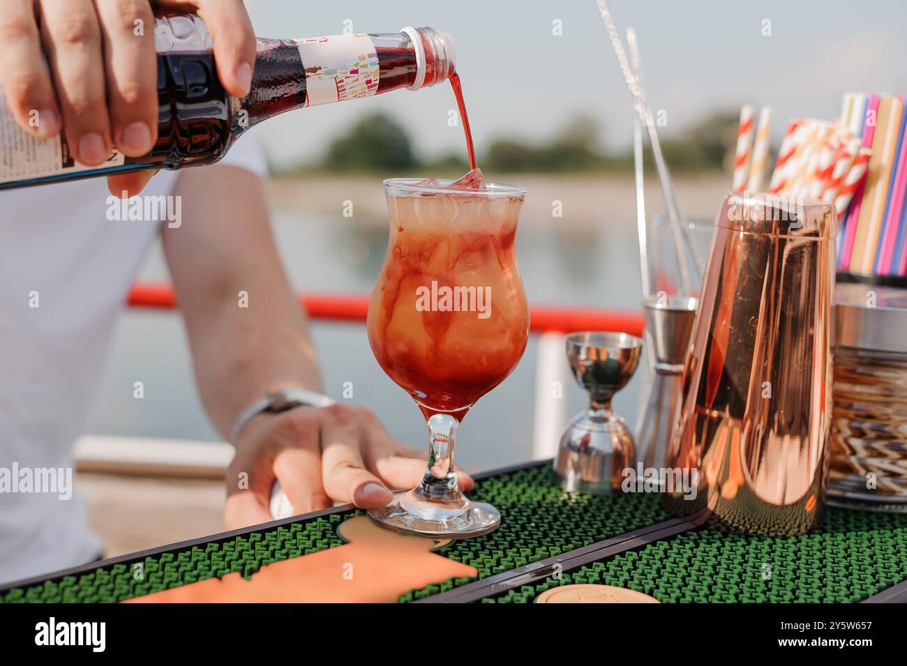 Refreshing Summer Cocktail Being Poured into Stylish Glass on Bar ...