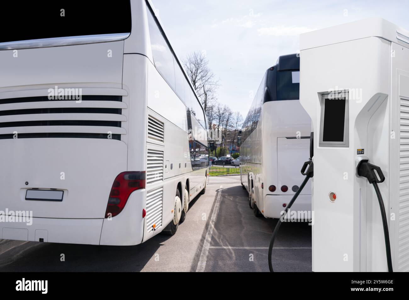 Electric buses with charging station Stock Photo - Alamy