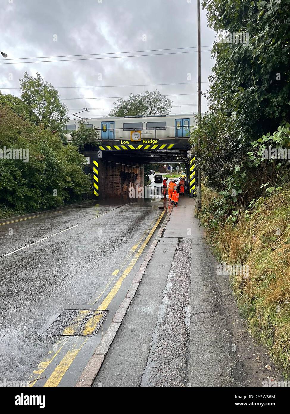 Flooding under a railway bridge on Cambridge Road in Hitchin. An amber ...