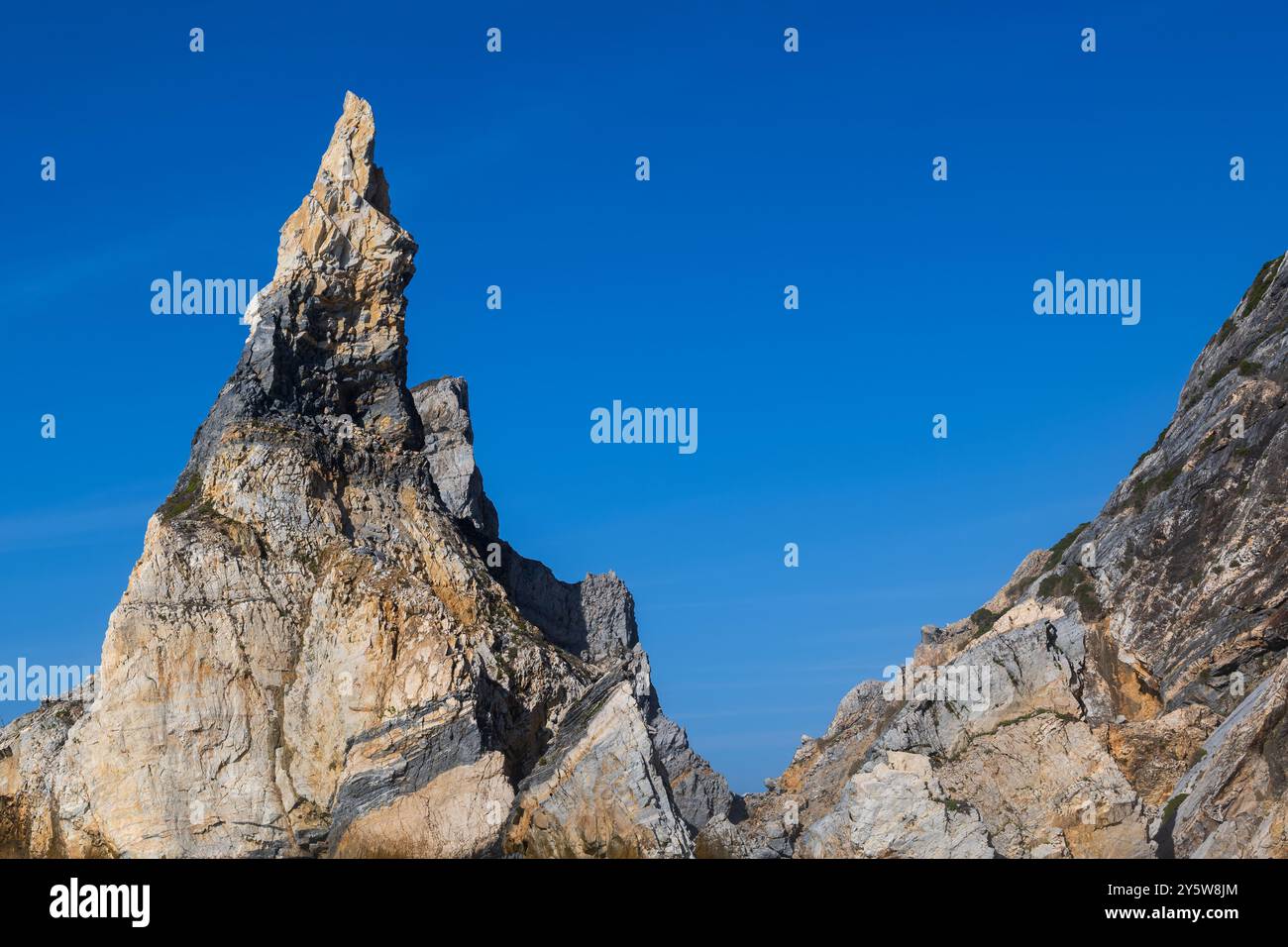 Pointy rock formation at Praia da Ursa in Portugal. Striking rocks ...