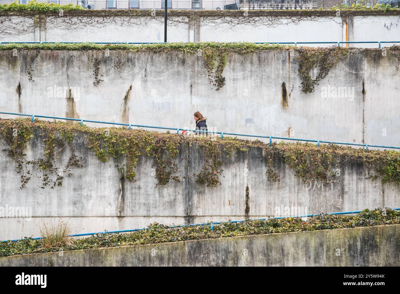 London, UK - January 25, 2024 - A mother pushing a baby buggy through ...