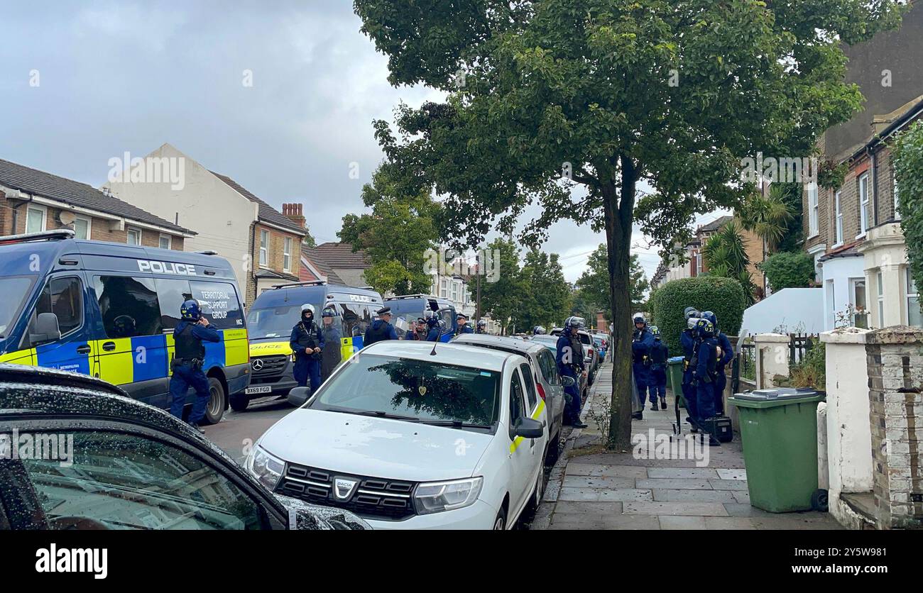 Metropolitan Police Territorial Support Group officers and vans at the ...