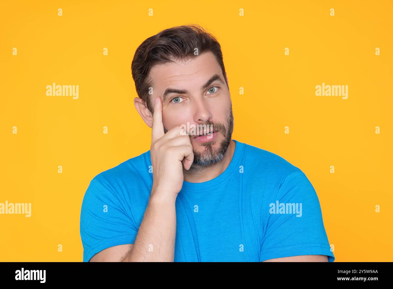 Thinking concept. Portrait of focused smart and creative man, holding ...